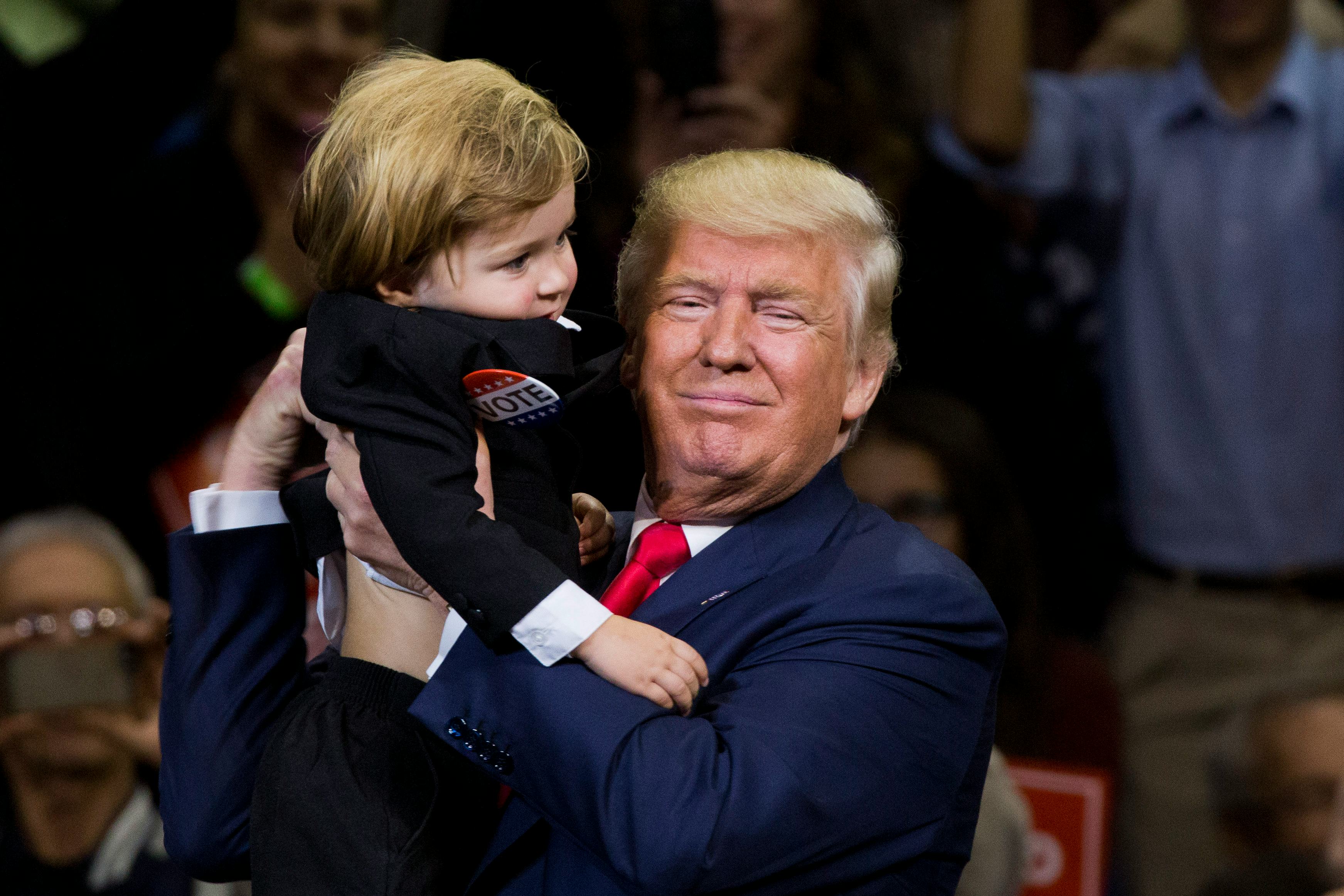 These Photos Of Donald Trump Holding A Baby Are Hilarious & Fitting
