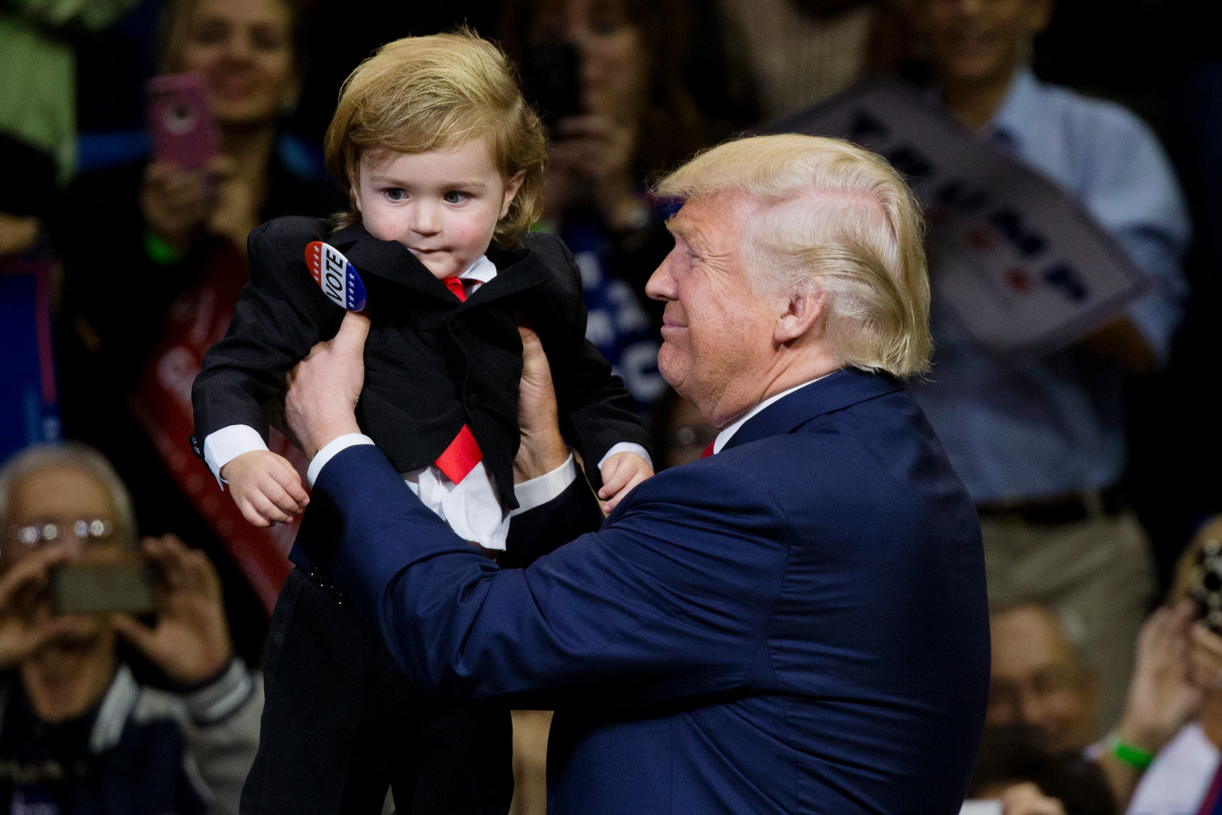 These Photos Of Donald Trump Holding A Baby Are Hilarious & Fitting