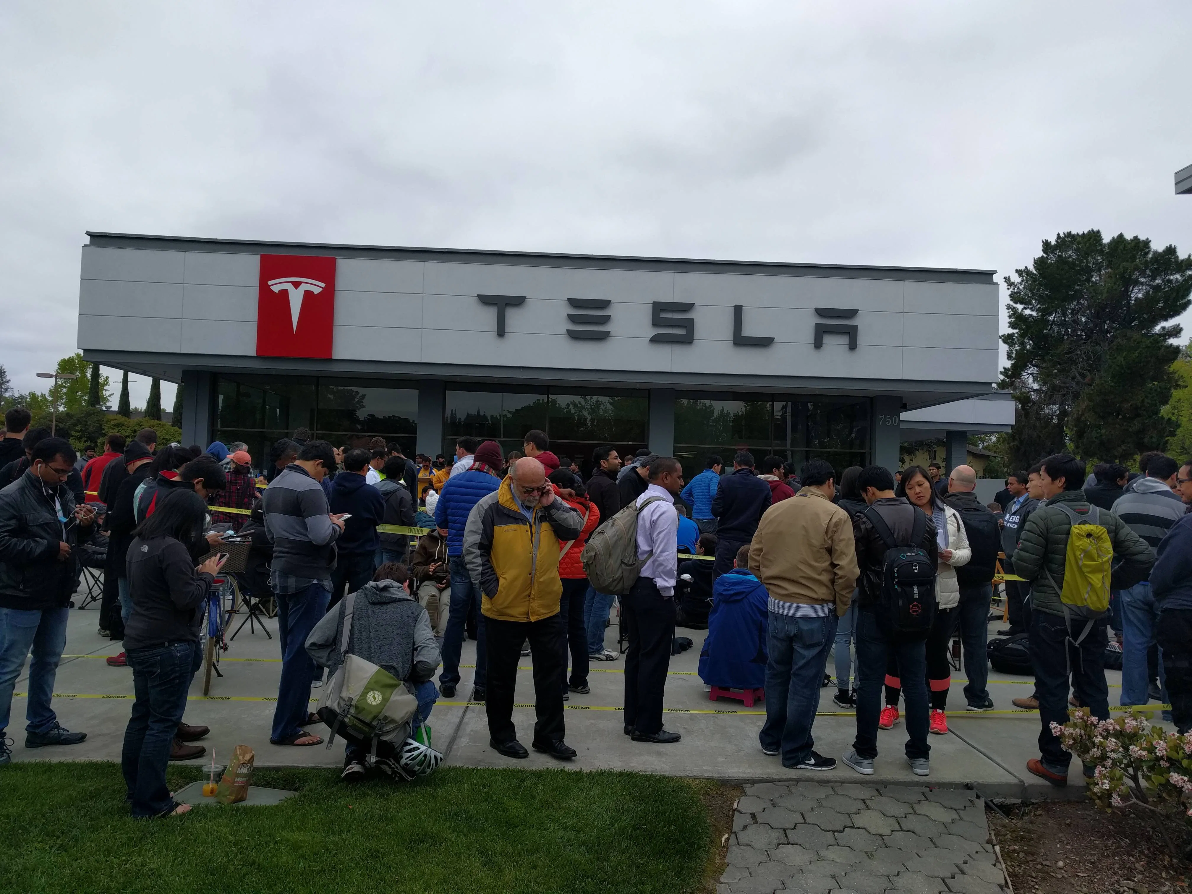 30 Photos of People Waiting in 30 Cities for the Tesla Model 3