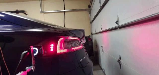 Watch an Autonomous Tesla Charger Plug Itself In to a Model S