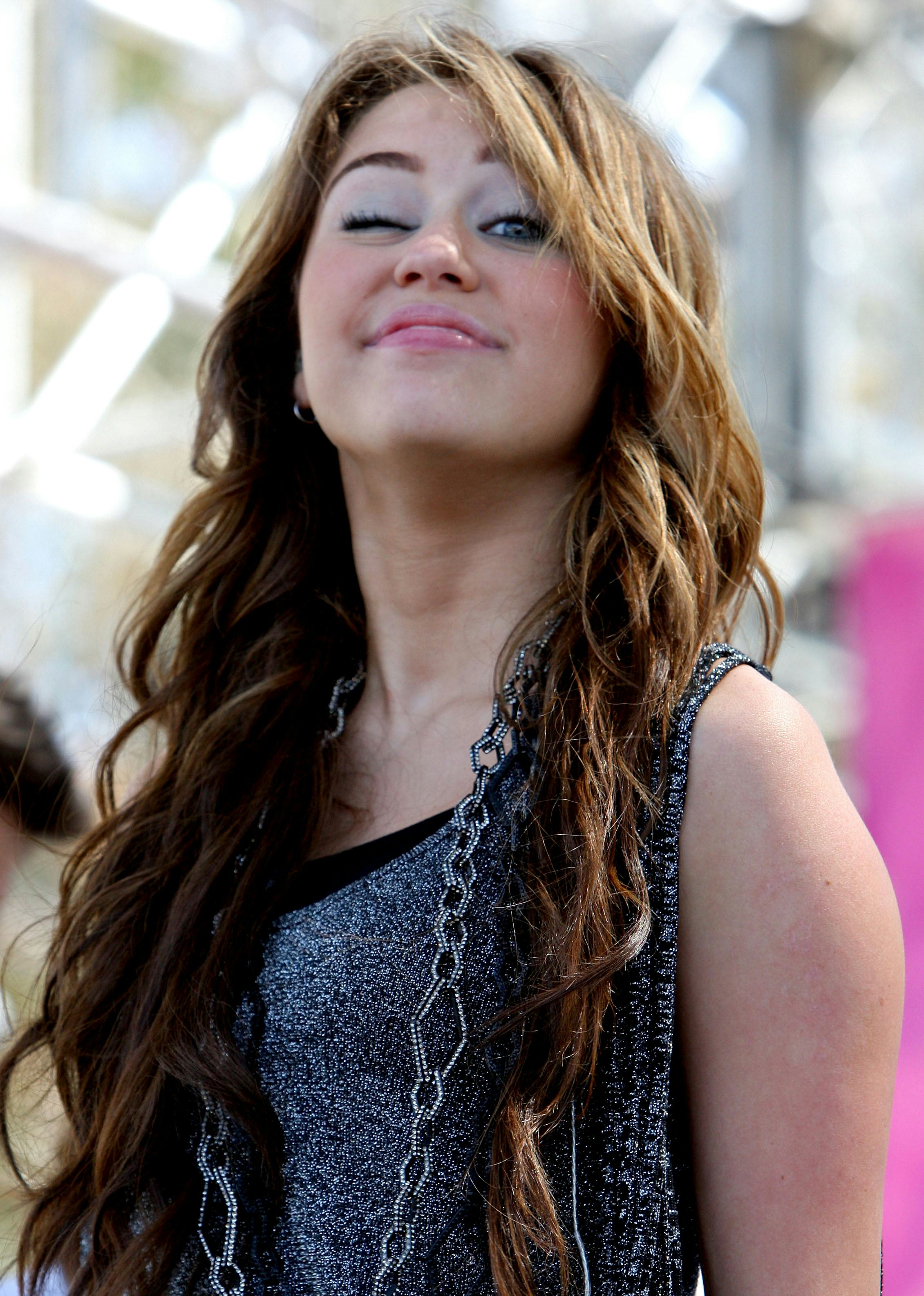 Miley Cyrus Wears Red Wig, Mimics Rapunzel, And Looks All-Around Great ...