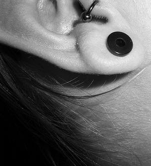 Does A Tragus Piercing Hurt? Plus, Everything Else You Need To Know ...