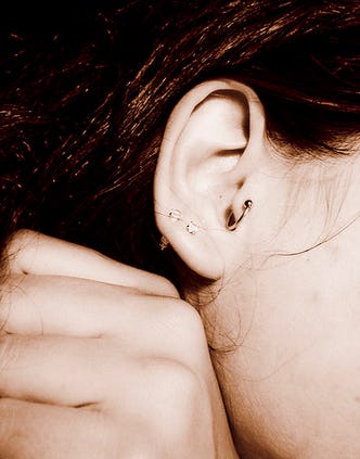 Does A Tragus Piercing Hurt? Plus, Everything Else You Need To Know ...