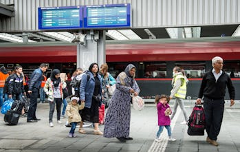 15 Triumphant Photos Show Thousands of Refugees Being Welcomed Into Germany