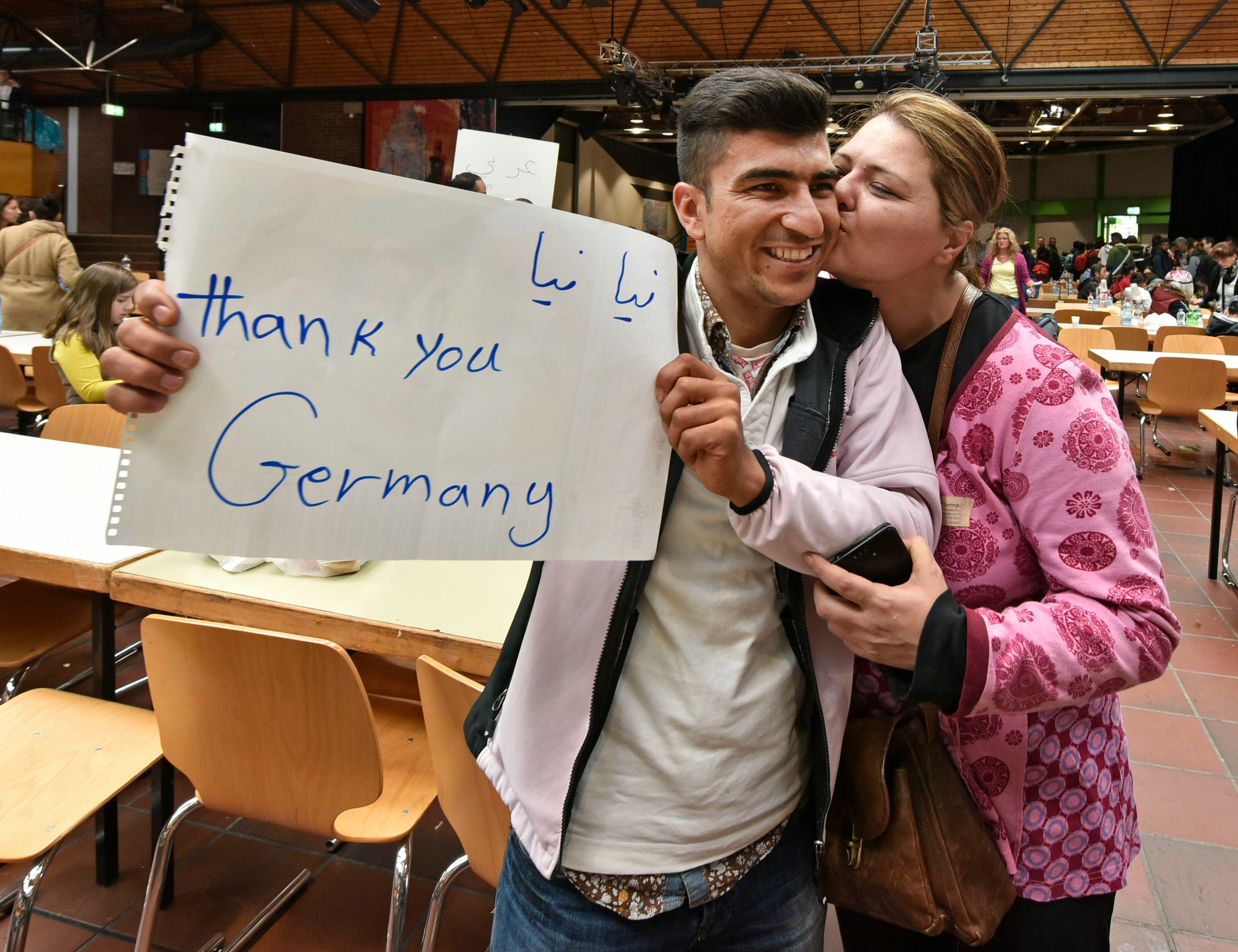 15 Triumphant Photos Show Thousands of Refugees Being Welcomed Into Germany