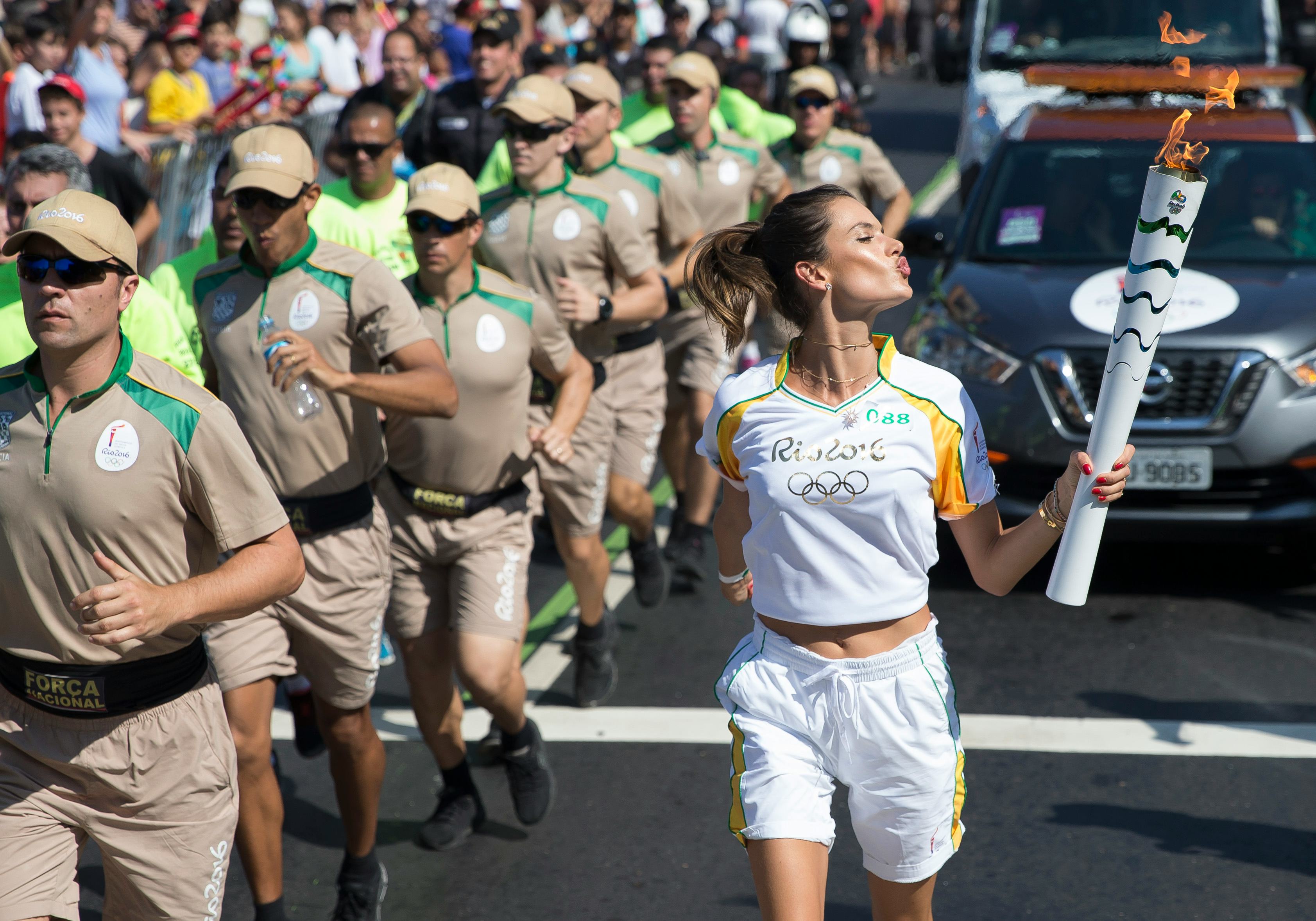 What Does the Olympic Torch Symbolize? Here's a Brief History of What ...