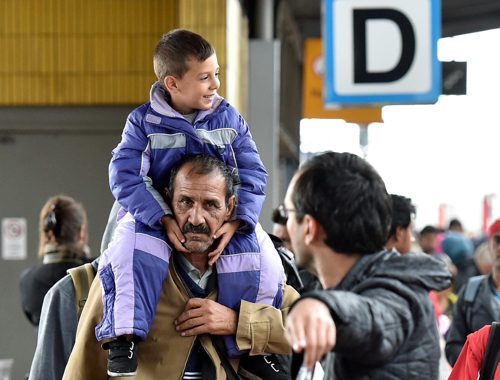 15 Triumphant Photos Show Thousands of Refugees Being Welcomed Into Germany