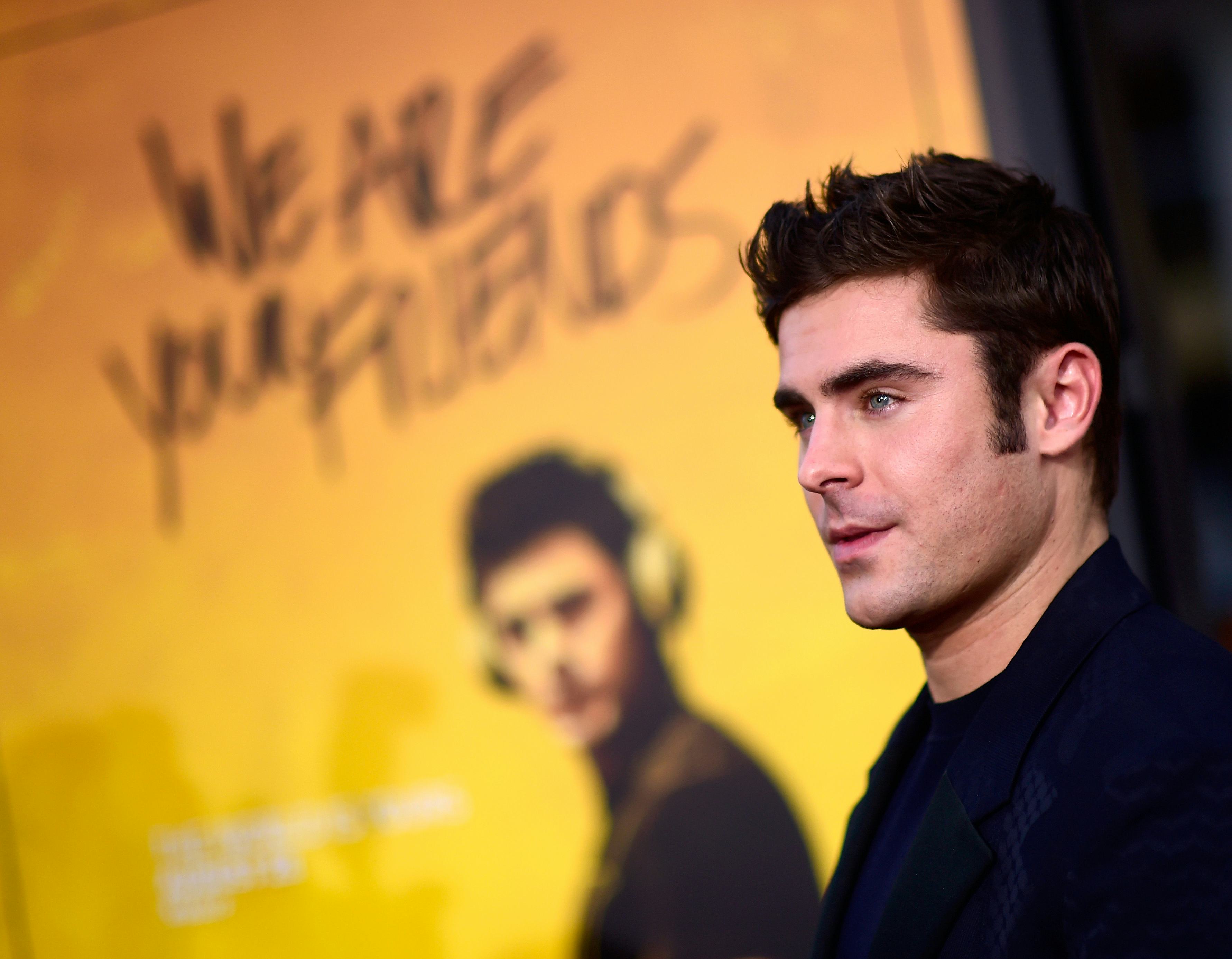 A Reporter Dedicates A Song To Zac Efron During Interview