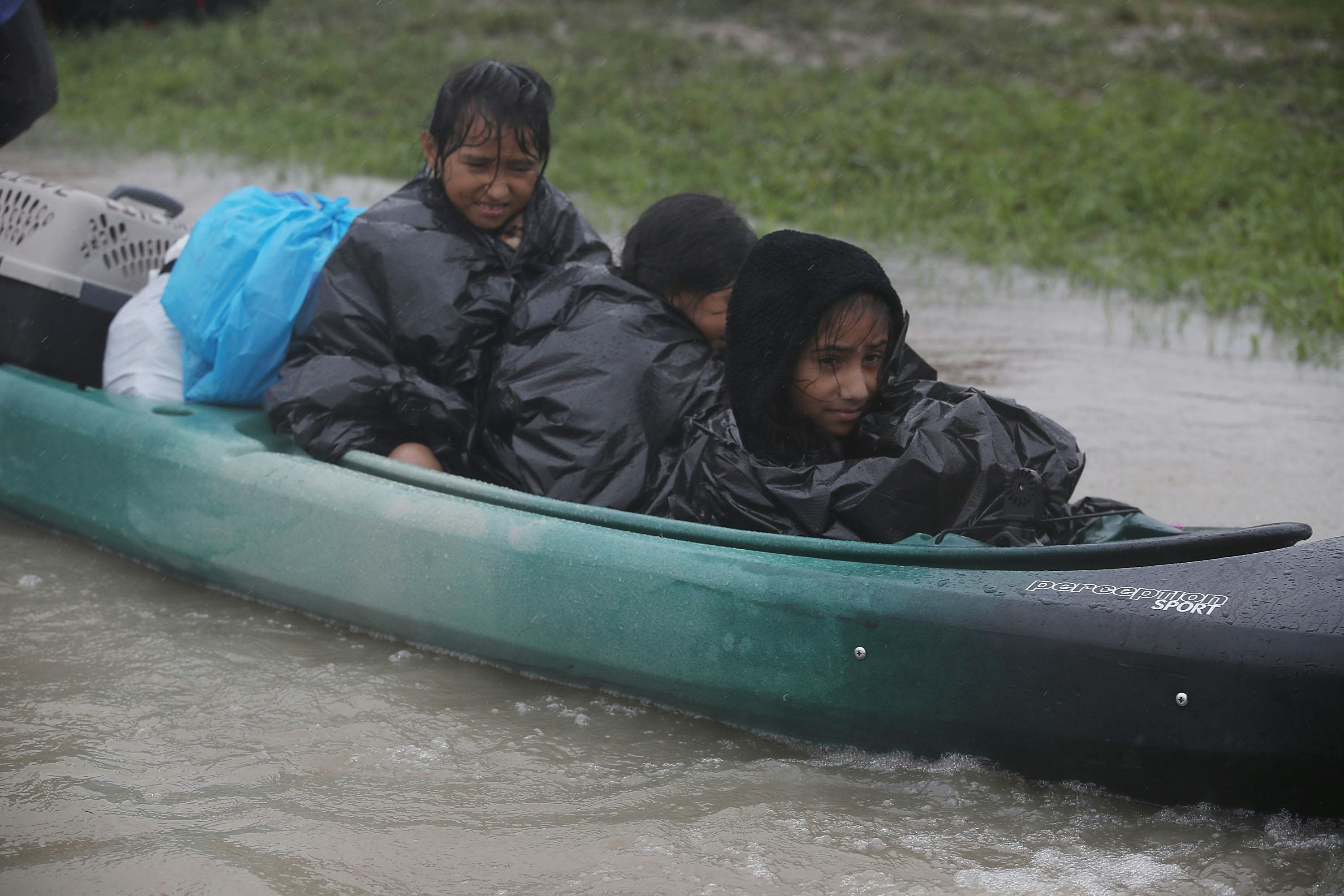 Photos Of Children Being Rescued From Flood Waters Will Stop Any Parent ...