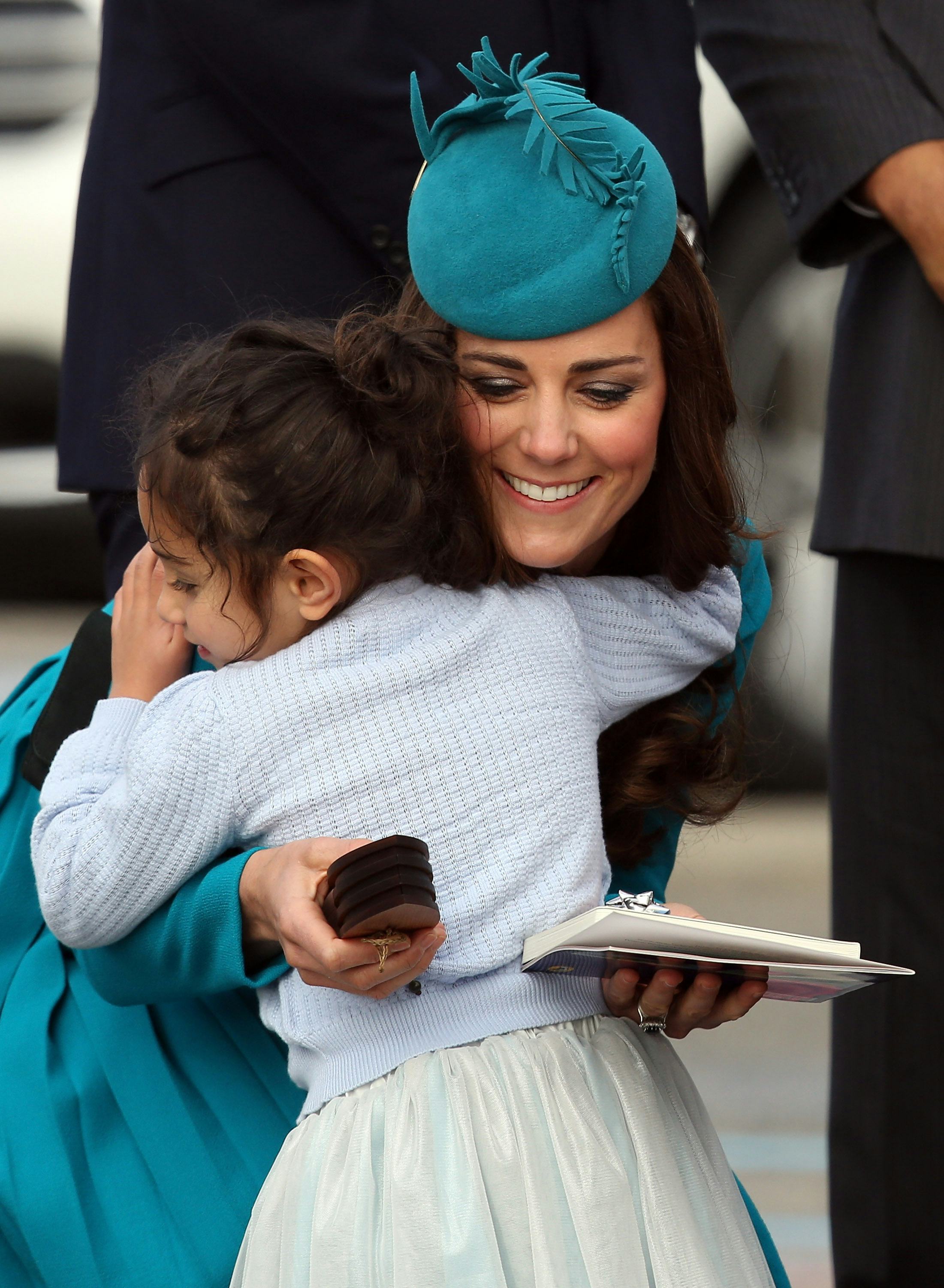 These Photos Of Meghan Markle & Kate Middleton Hugging Commoners Will ...