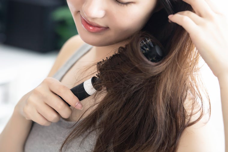 6 Ways To Protect Your Hair In The Snow, According To An Expert