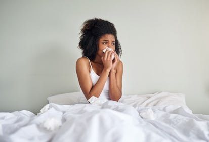How The Flu Might Affect Your Period, According To Experts