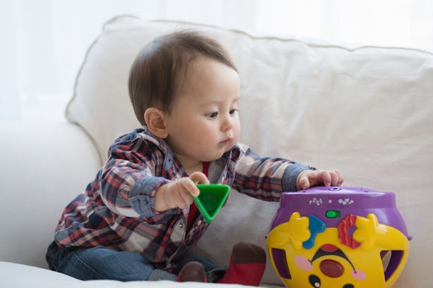 Why Do Babies Love Putting Things In Boxes? Experts Say It's Important