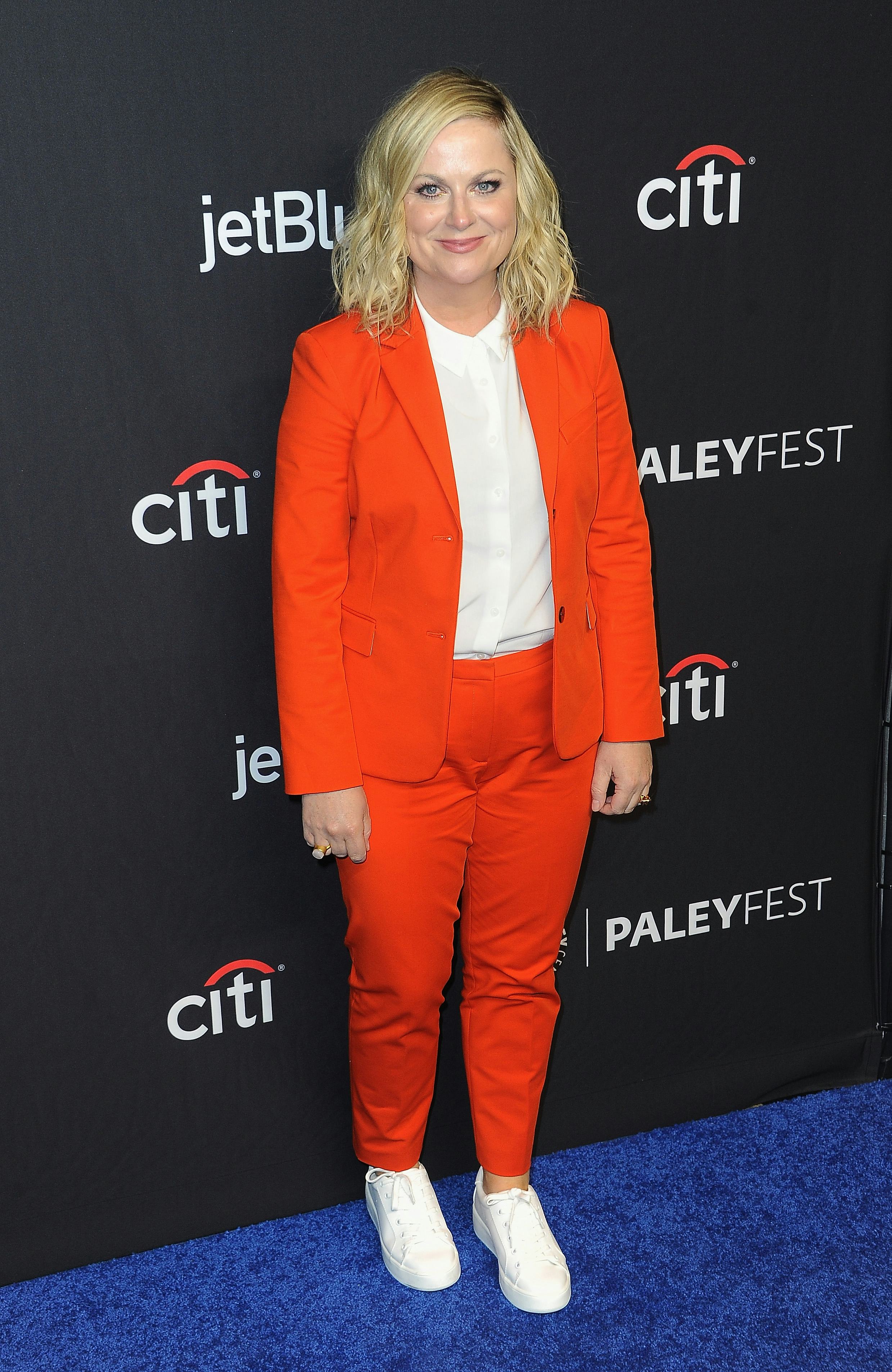 Amy Poehler's Hot Pink Suit Is A Lesson In Pulling Off Neon