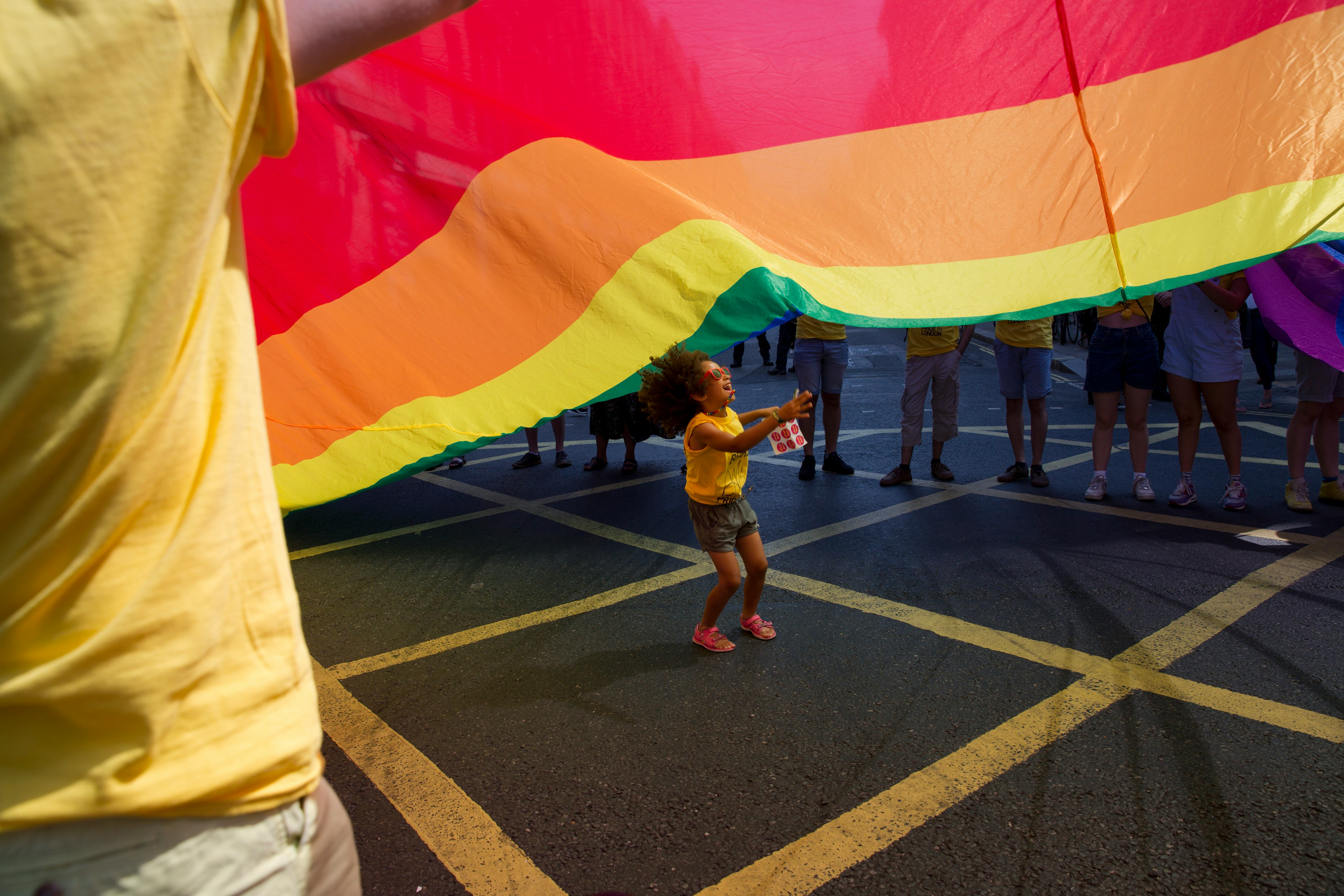 Beautiful Photos Of Parents & Kids Celebrating Pride Over The Years