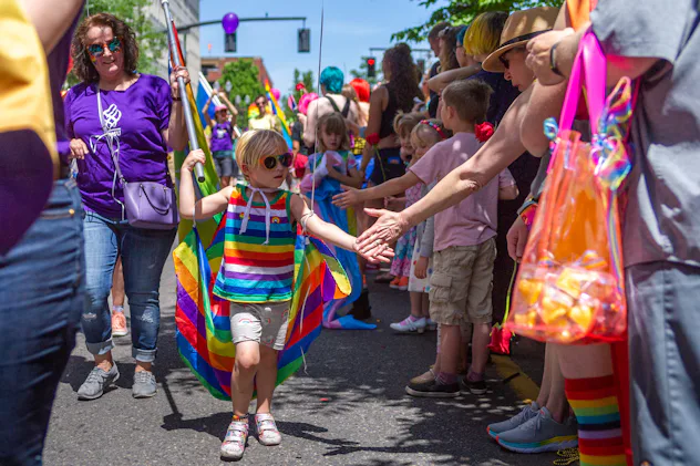 Beautiful Photos Of Parents & Kids Celebrating Pride Over The Years