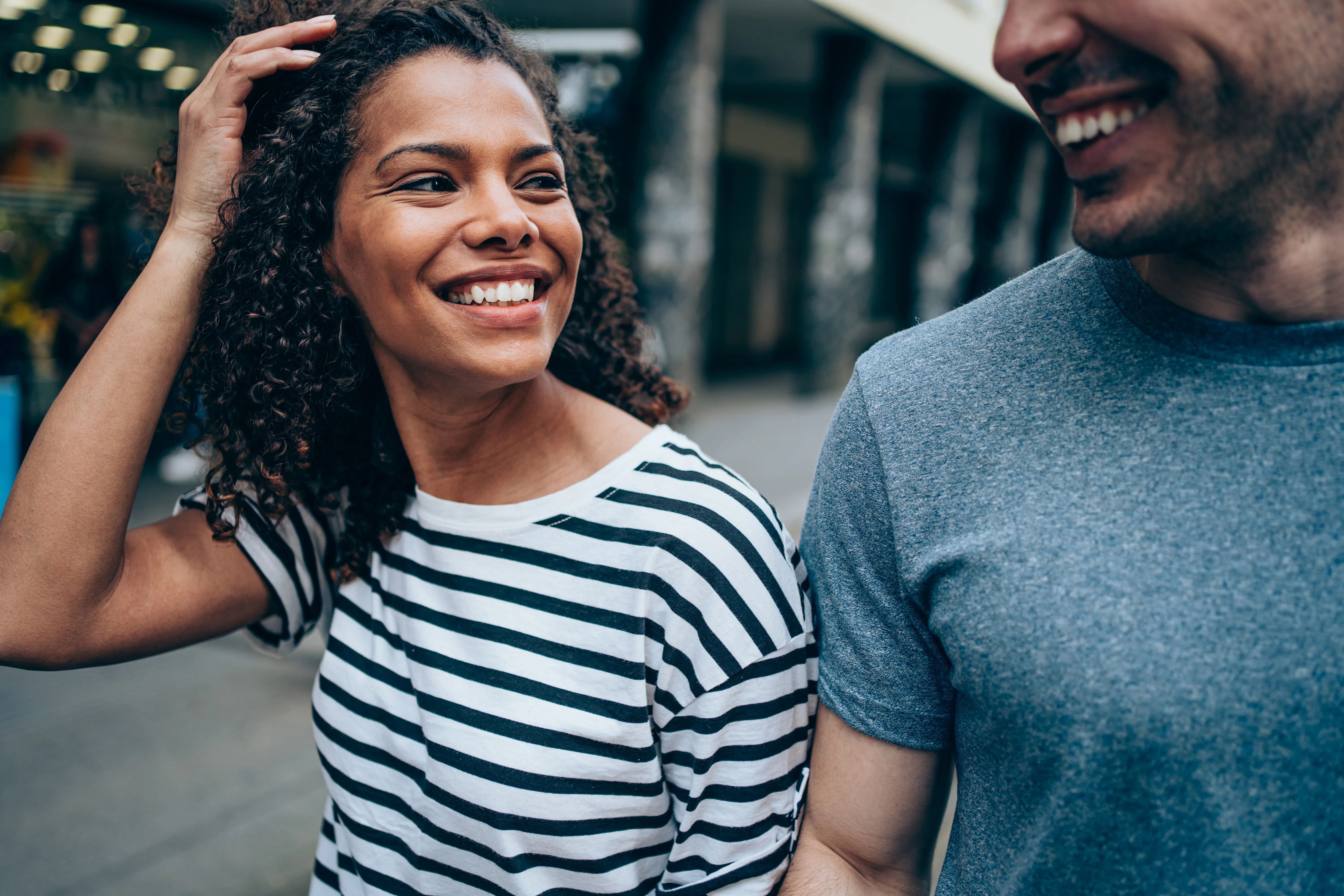 How To Flirt With A Friend You Like: 8 Tips From Dating Experts