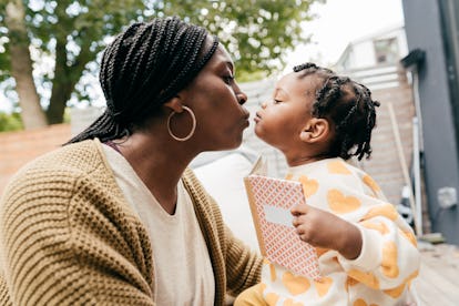 These 90 Baby Names That Mean Red Are Inspired By Fire, Flowers, & Folklore