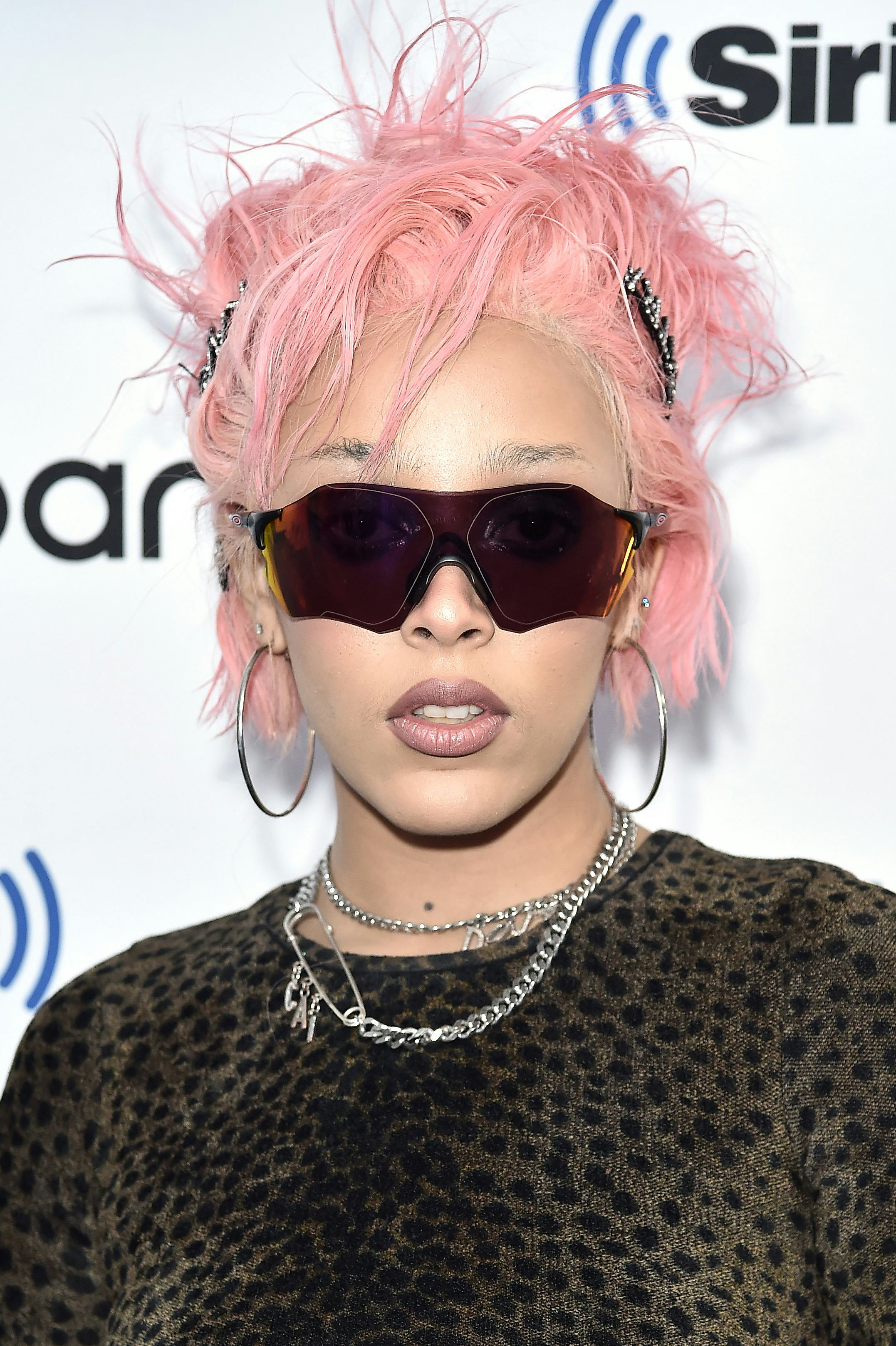 Doja Cat's Hair Evolution, From Golden Lobs To Bold Buzzcuts