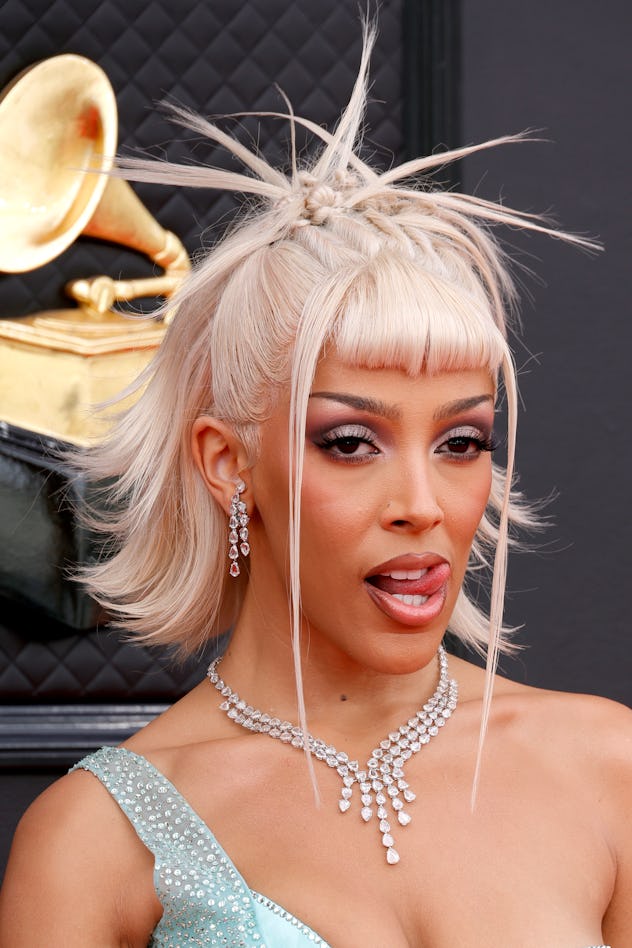 Doja Cat's Hair Evolution, From Golden Lobs To Bold Buzzcuts