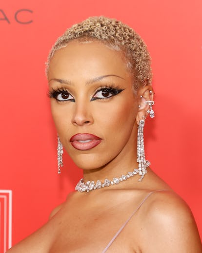 Doja Cat's Hair Evolution, From Golden Lobs To Bold Buzzcuts