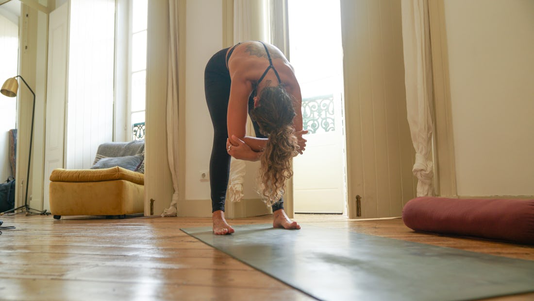 The 7 Best Back Stretches To Do Every Day, According To Trainers