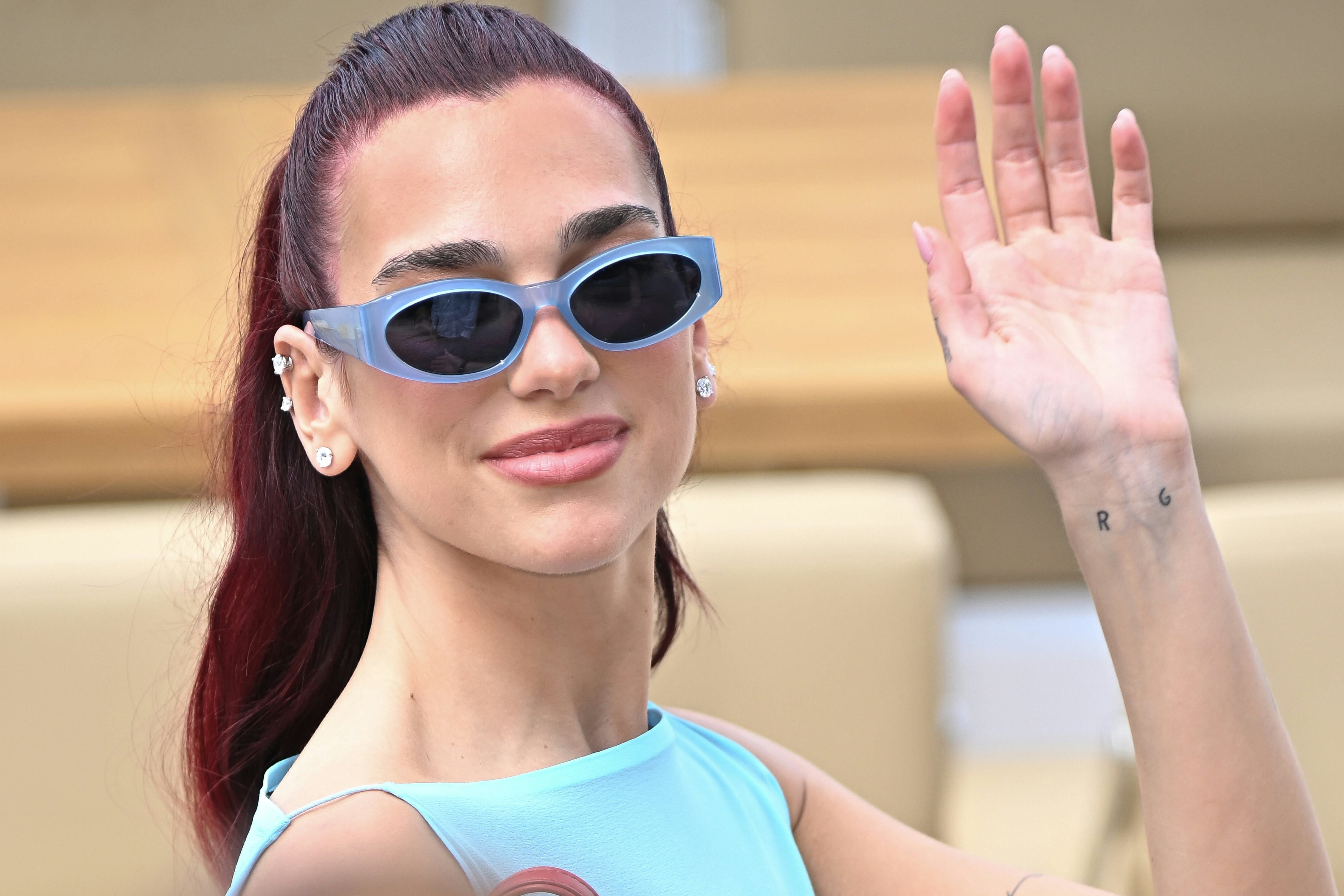 Dua Lipa Wore Gucci's $10,700 Yellow Leather Trench Coat