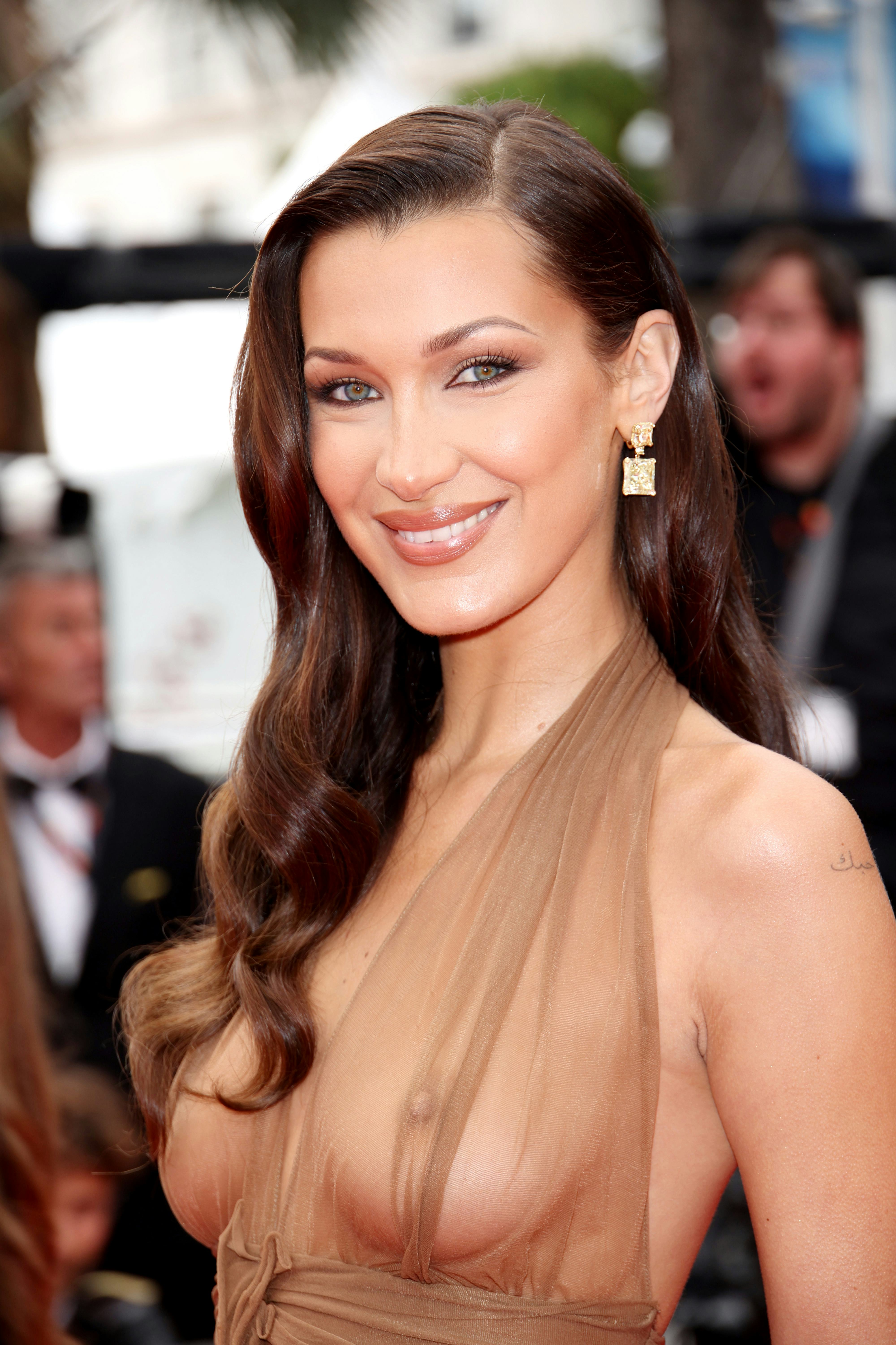 Bella Hadid Wore A Sheer Tank & Lacy Skirt In Her Latest YSL Campaign