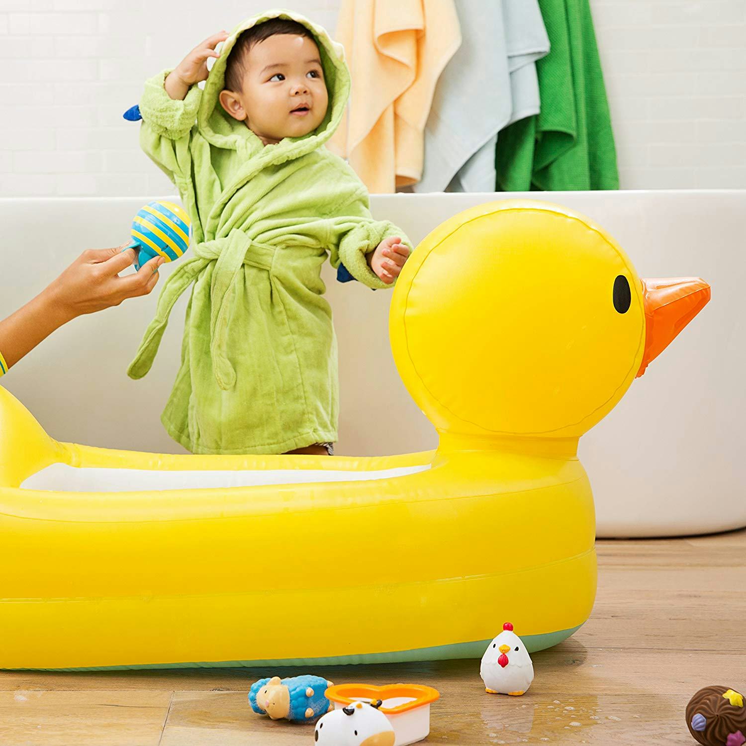 Munchkin's Inflatable Swan Tub Keeps Babies Safe During Bath Time, & It ...