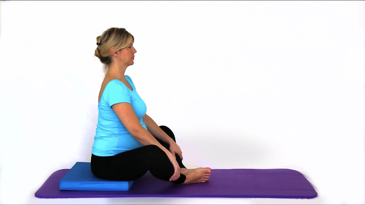 7 Yoga Poses To Induce Labor, Because You're Ready To "Om" This Baby Out