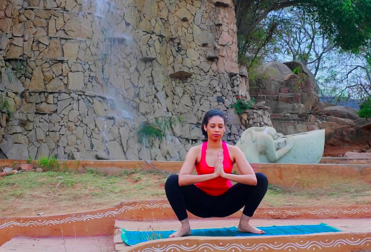 7 Yoga Poses To Induce Labor, Because You're Ready To "Om" This Baby Out