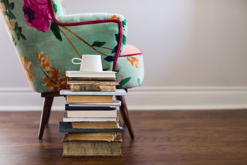 10 Reading Hacks For Finally Getting Through Your Overstacked TBR Pile