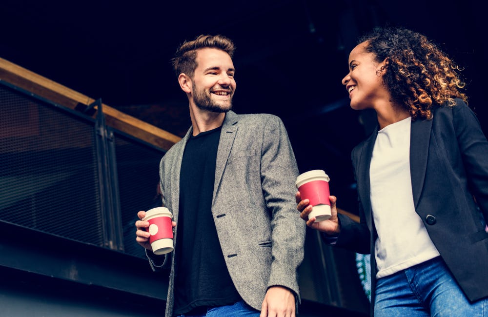 9 Differences Between Being Friendly Vs. Flirty, According To Experts