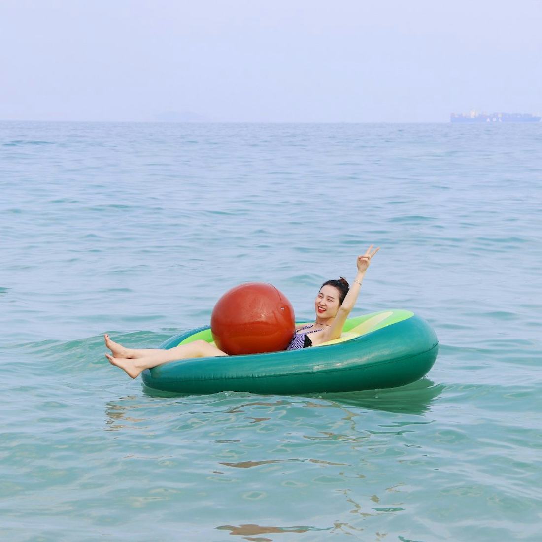 This Avocado Pool Float Comes With A Removable Pit That's a Beach Ball