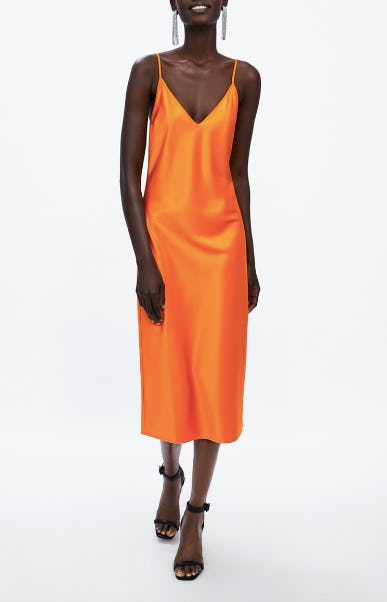 Chrissy Teigen’s Orange Dress Proves That The Color Is The Biggest ...