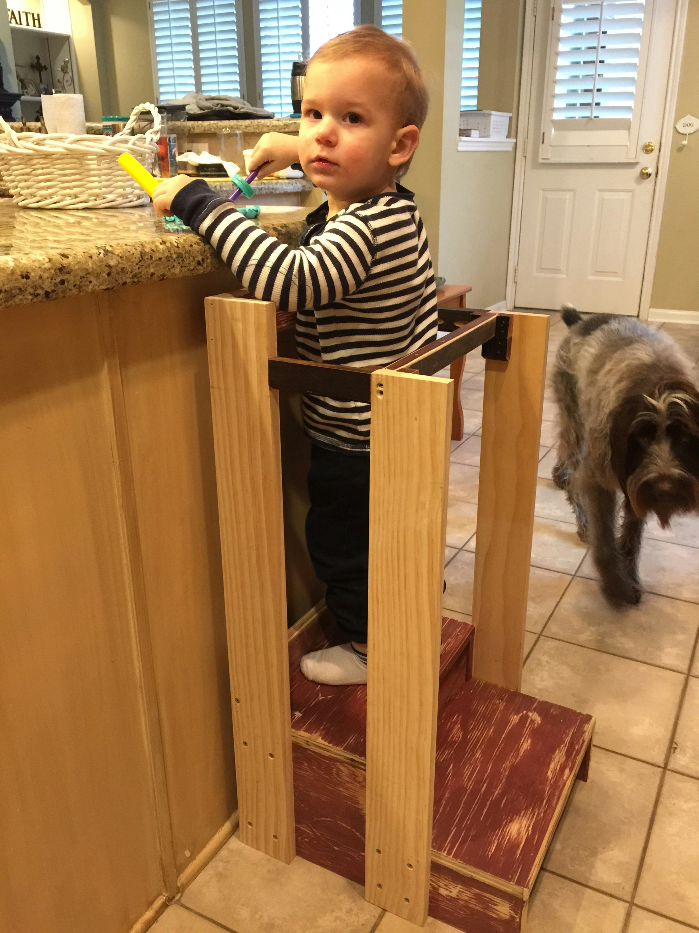 How Do Learning Towers Benefit A Kid? They're All The Rage For A Big Reason