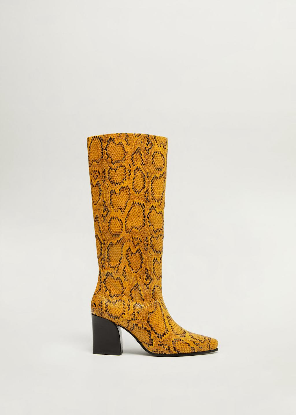 Everyone's Tucking Their Pants Into Boots, Here's Why