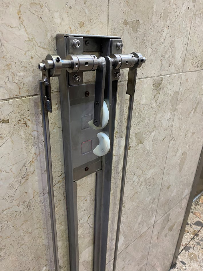 This foot-operated elevator button eliminates the need for touching