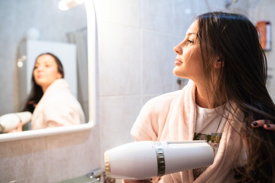 Letting Hair Air Dry Has Pros & Cons — Here's What To Know