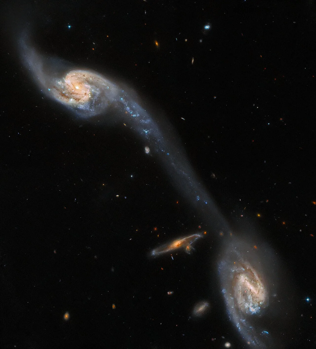 Hubble Telescope Video: Spiraled Galaxies & An Intergalactic Bridge