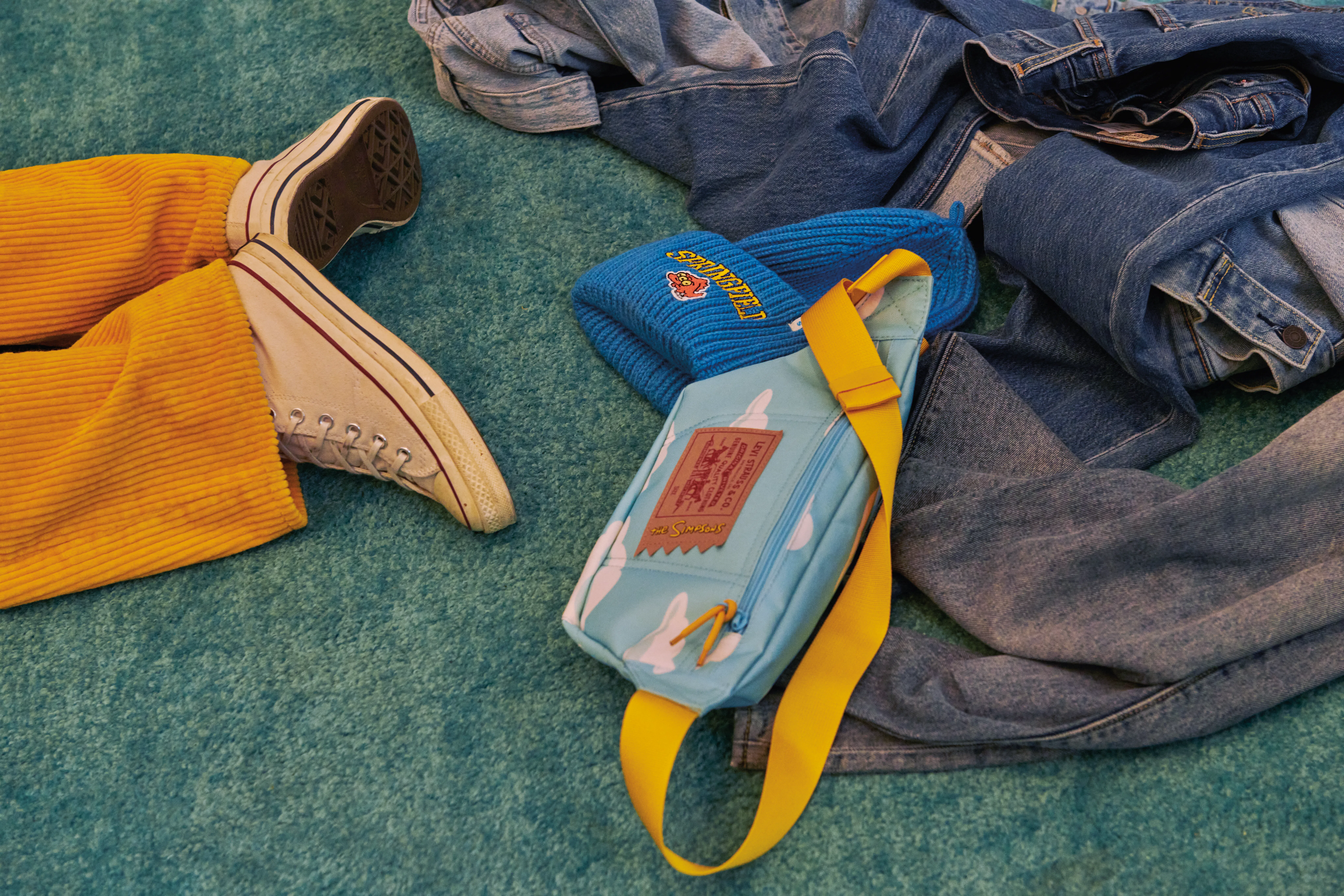 The Levi's x 'Simpsons' Collaboration Includes Puffers, Bucket Hats, & More
