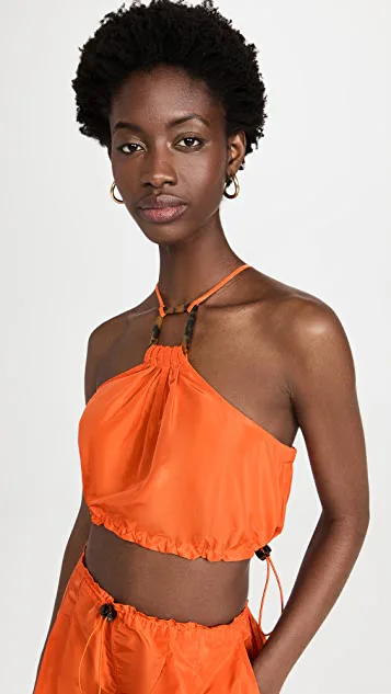 8 Halter Top Outfits That Showcase The Garment’s Versatility