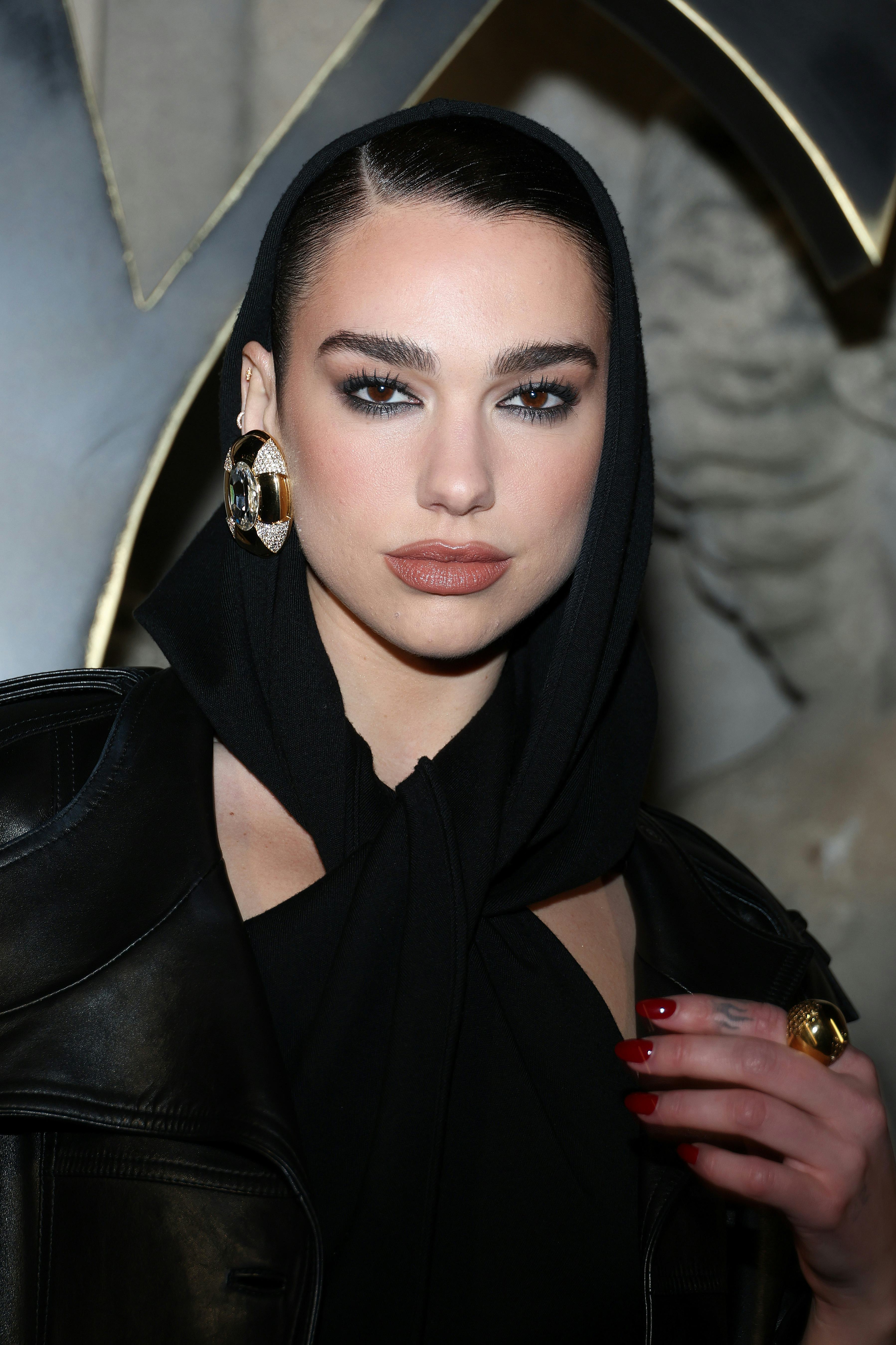 8 Times Jenna Ortega, Miley Cyrus, & More Wore Hooded Outfits In 2023