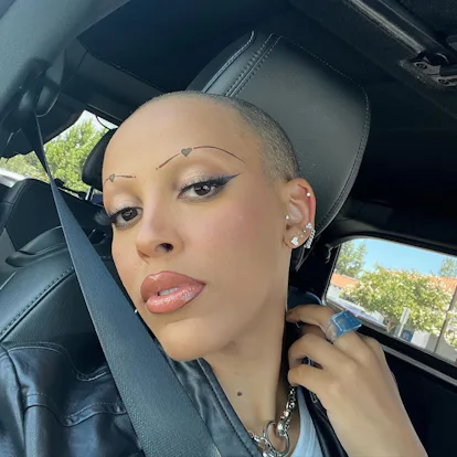 Doja Cat's Hair Evolution, From Golden Lobs To Bold Buzzcuts