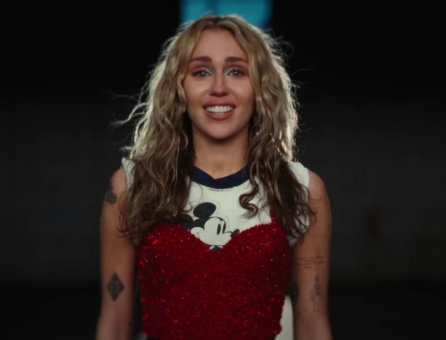 Miley Cyrus Wore a Mickey Mouse Top In Her “Used To Be Young” Music Video