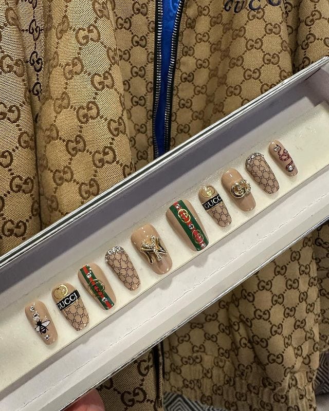 Jennifer Lopez's Custom Gucci Nails Are A Nod To Her Bronx Origin