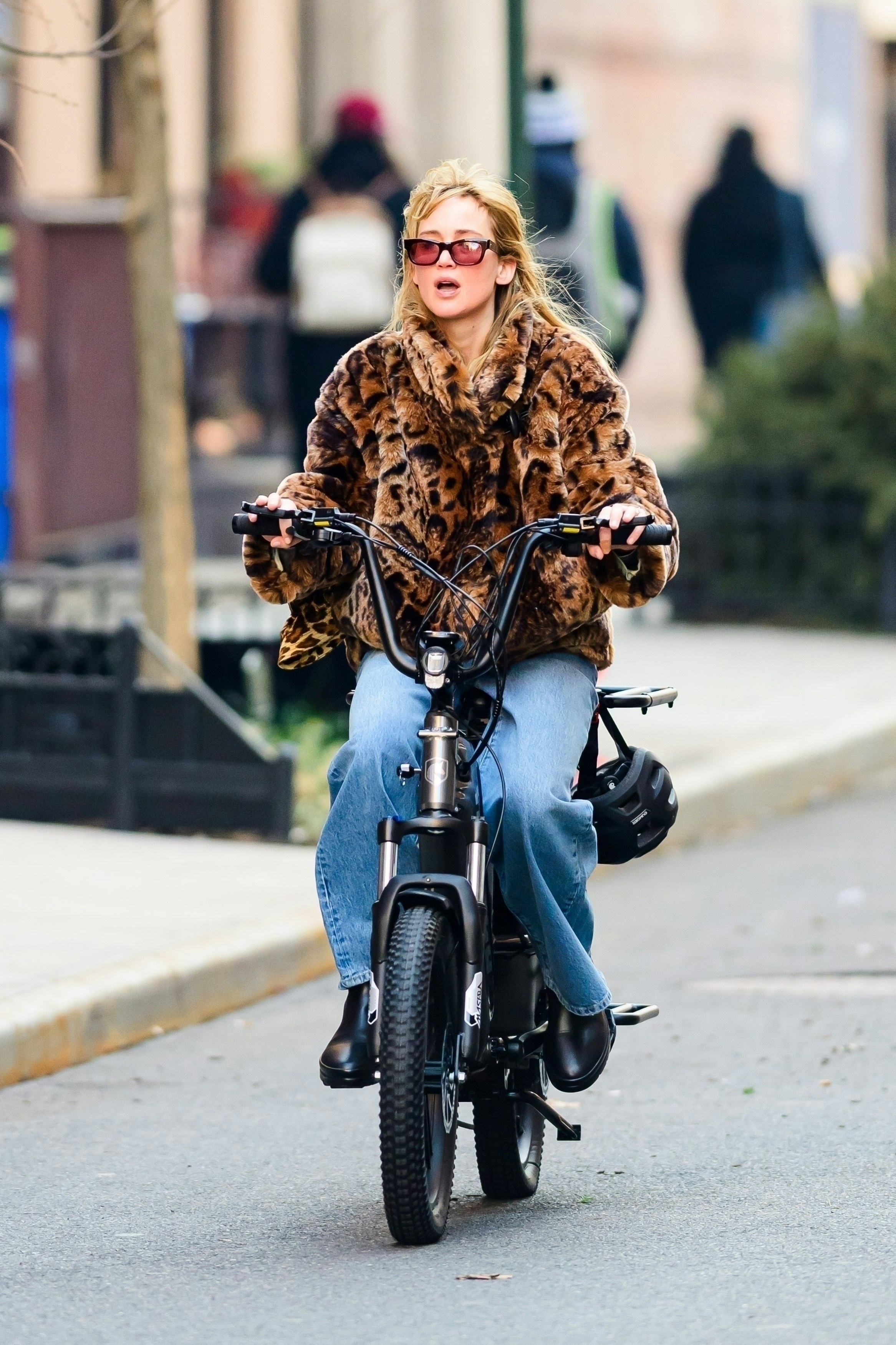 Jennifer Lawrence Looked “Biker Chic” In A Leopard Coat