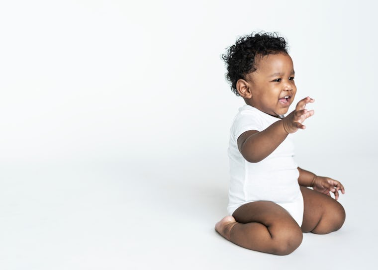 Why Do Babies Wave At Nothing? Experts Explain The "Creepy" Behavior