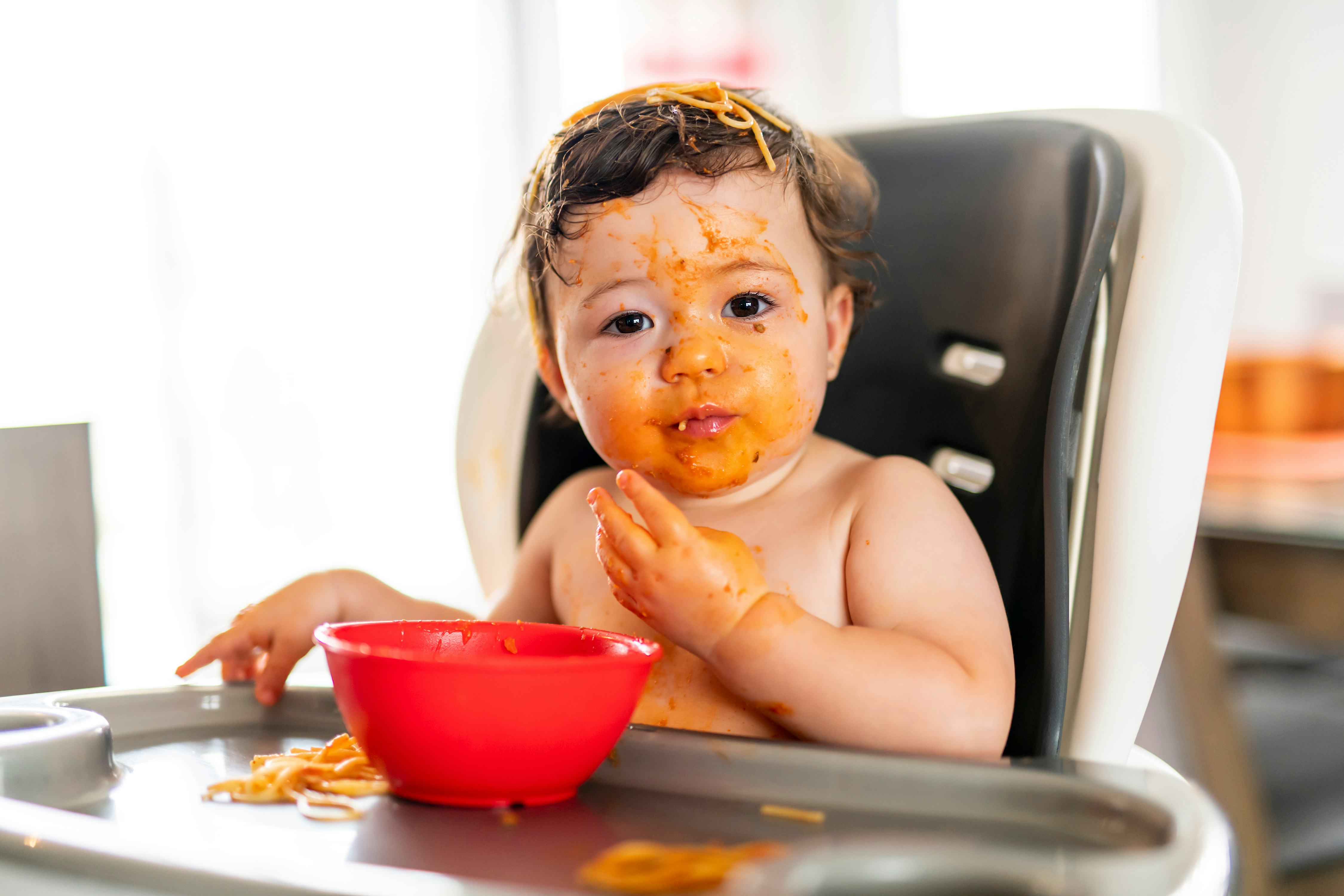 Why Do Babies Put Food In Their Hair? It's About More Than The Mess