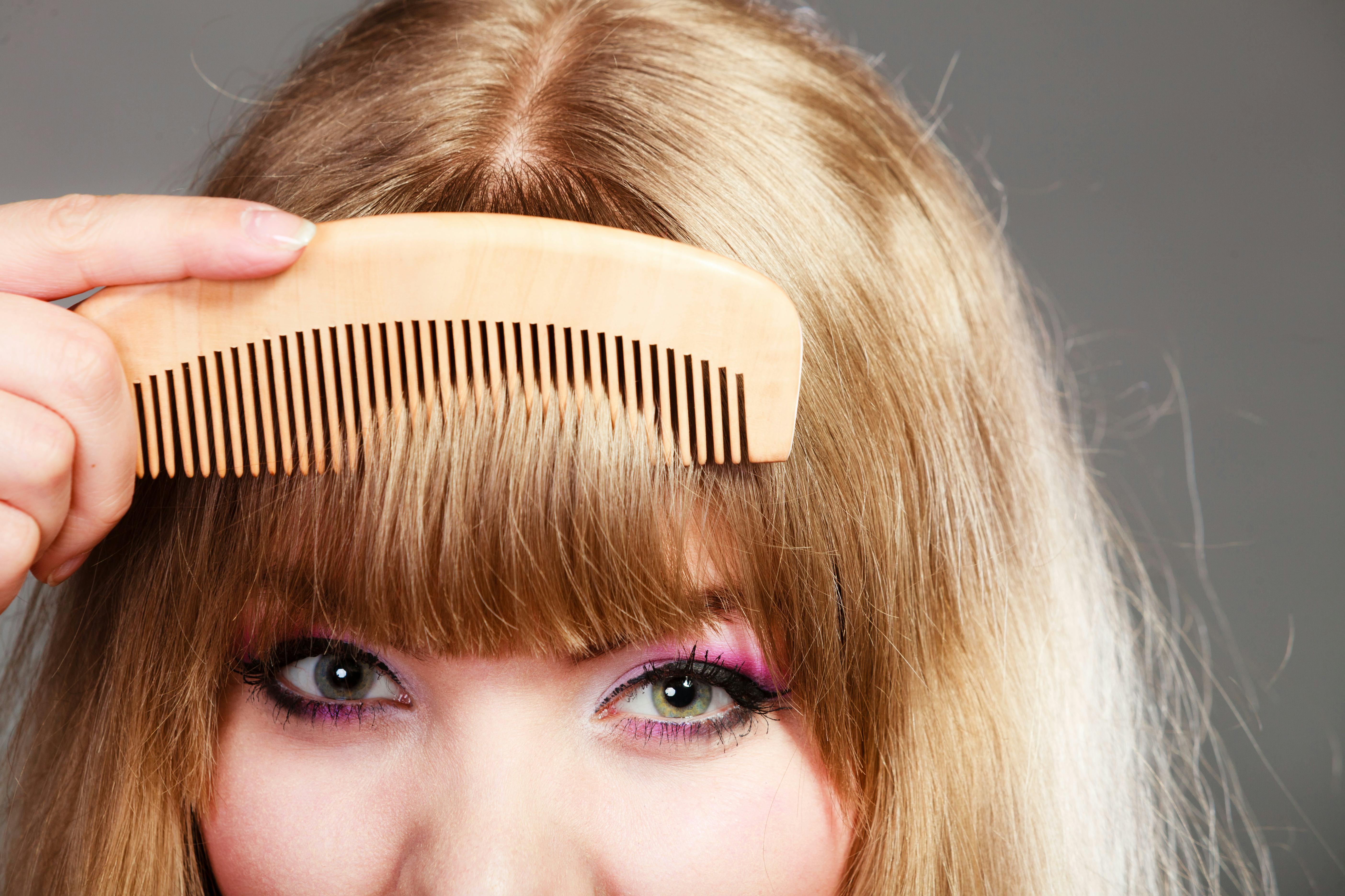 How To Trim Your Own Bangs At Home, According To Pro Hairstylists